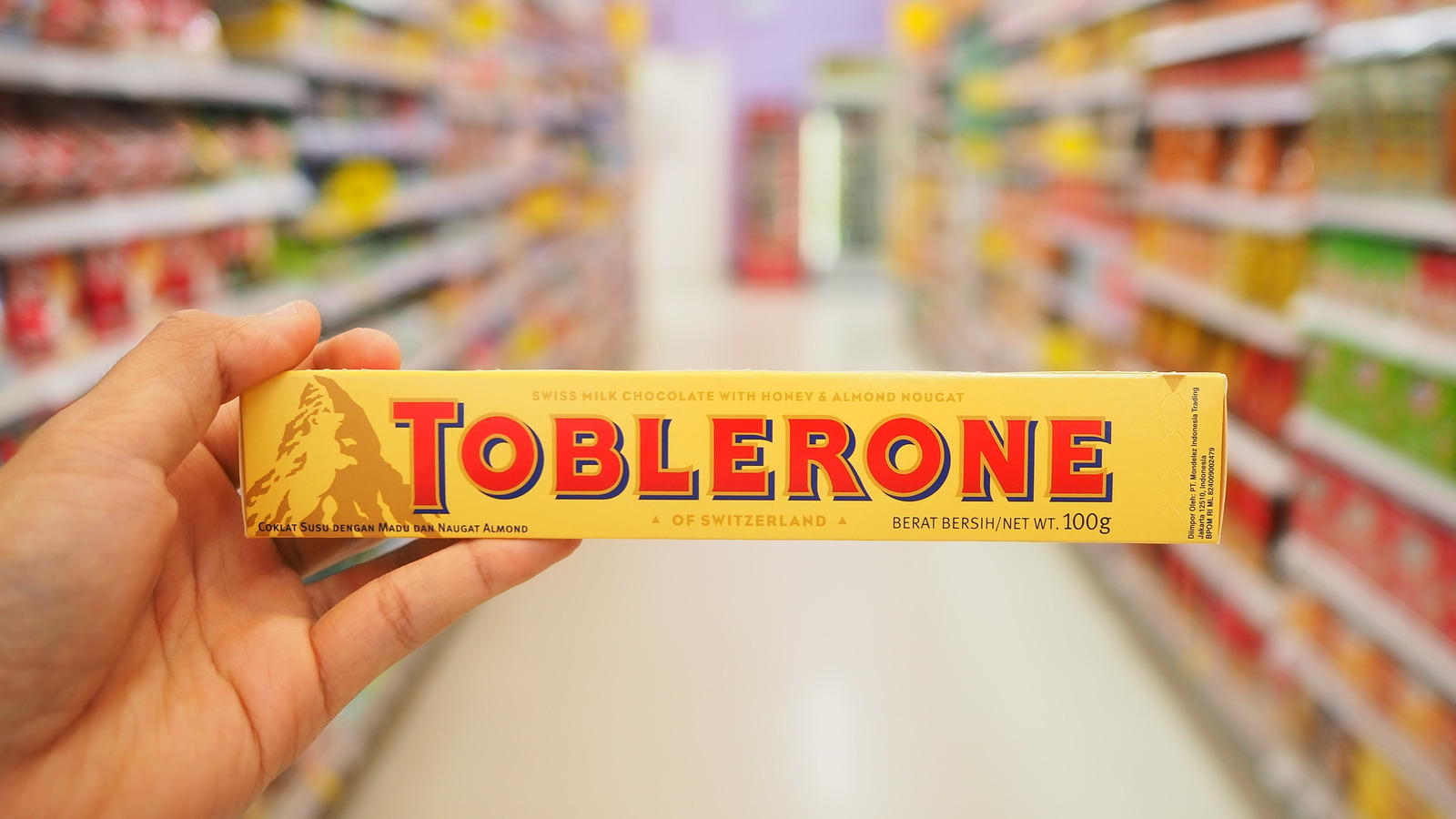 Bangkok,,Thailand,-,July,7,2019,:,Female,Hand,Holding,Toblerone ...